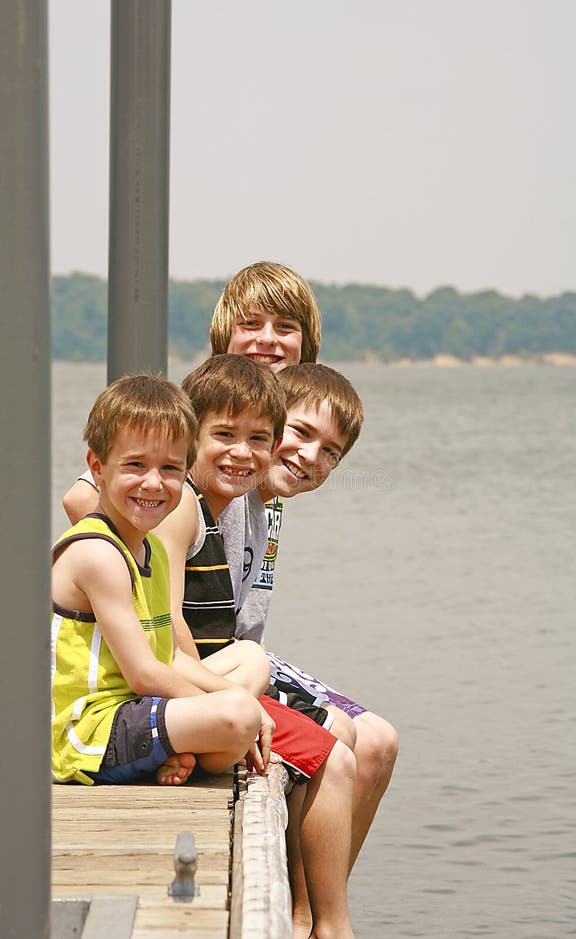 Boys on the Dock stock image. Image of families, happiness - 2931059