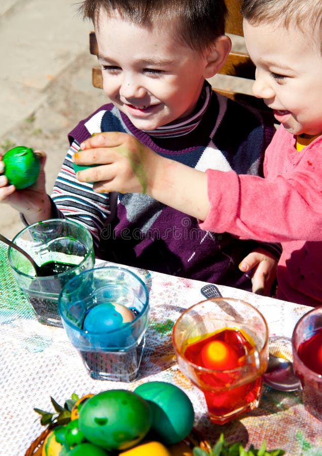 Boys fighting easter eggs stock image. Image of dyeing - 23539409