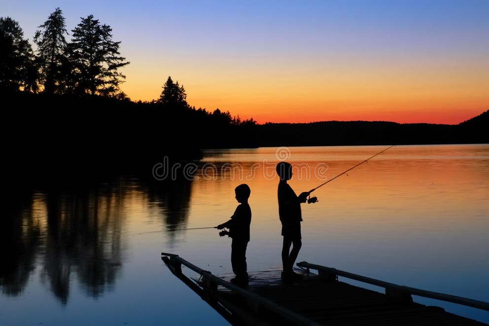Boys Fishing stock photo. Image of dawn, angling, lake - 11003100