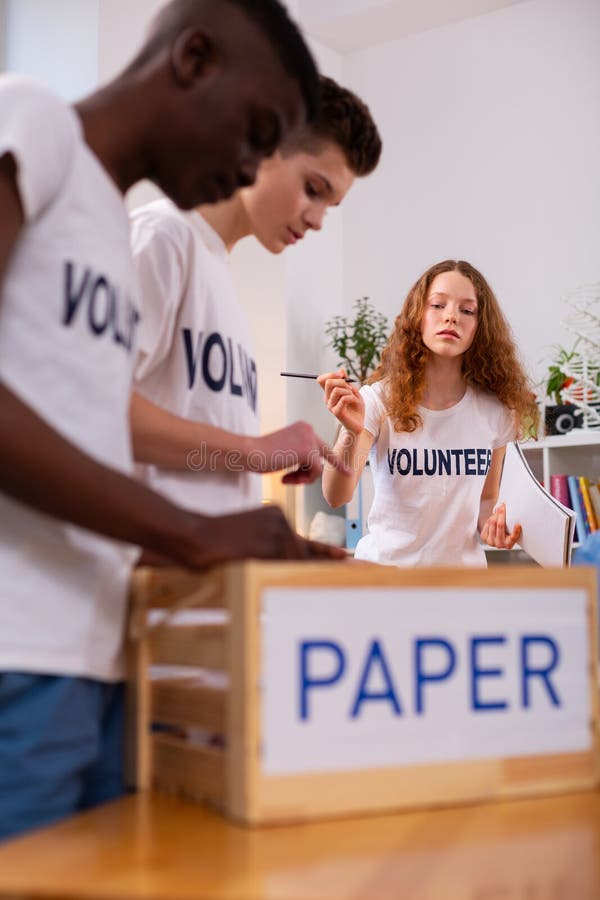 Boys and Girl Sorting Paper while Working in Ecology Organization Stock ...