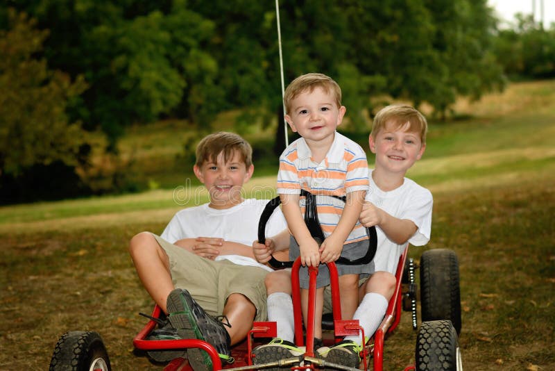 Boys on a go-kart stock photo. Image of three, recreational - 137074218