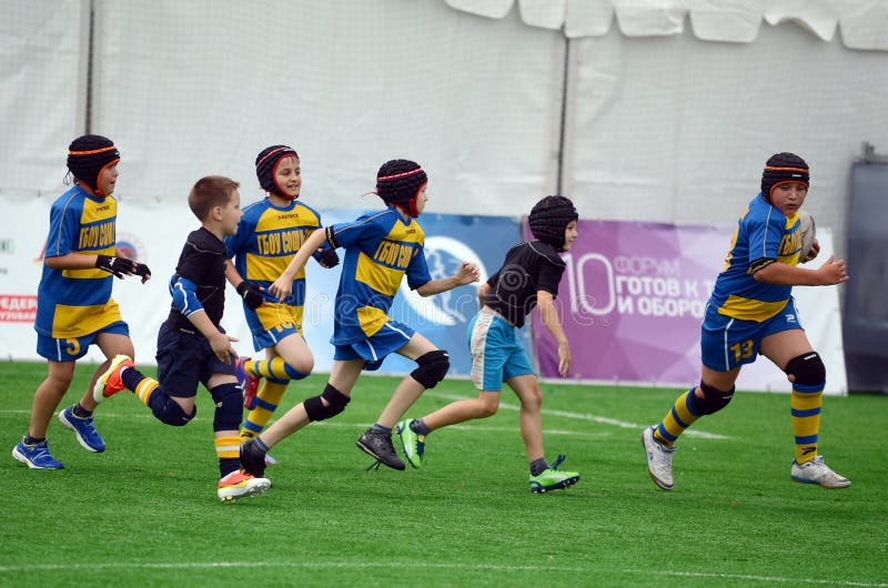 The boys play Rugby. editorial photography. Image of kids - 82811647