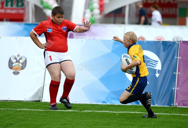The boys play Rugby. editorial stock photo. Image of field - 82811808