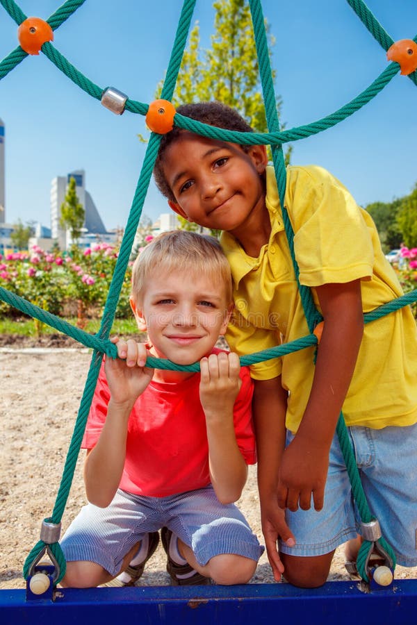 Friends on the Playground Slide Stock Image - Image of playful, outside ...