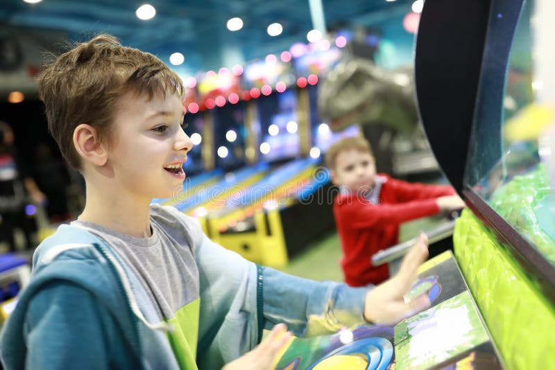 170 Boy Playing Arcade Game Machine Stock Photos - Free & Royalty-Free ...