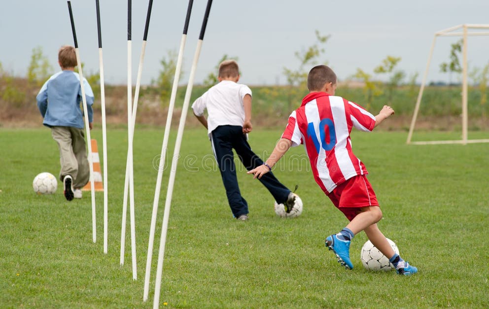 Boys playing with a ball stock photo. Image of shoe, exercising - 23877254