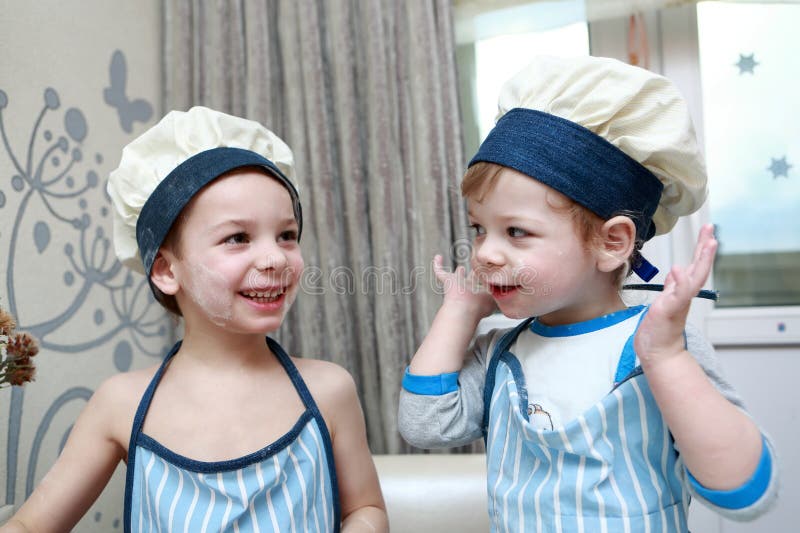 Boys playing in kitchen stock photo. Image of looking - 85560646