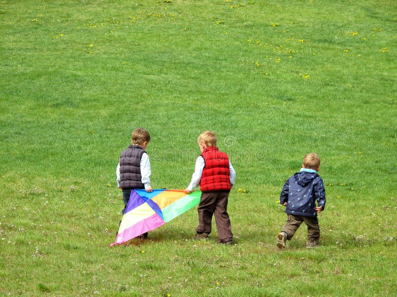 Boys playing with kite stock photo. Image of grass, boys - 9701192