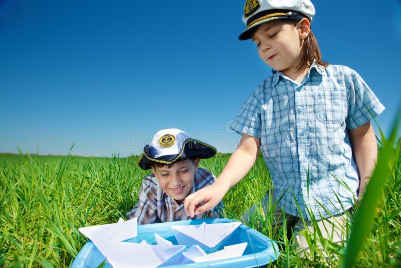 Boys Playing with Paper Boats Stock Image - Image of boat, navigate ...