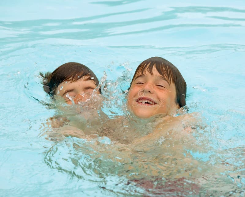 Two Boys at the Pool stock image. Image of childhood, happiness - 5613089