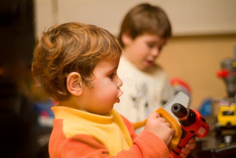 Boys playing with tools stock image. Image of happiness - 2072115