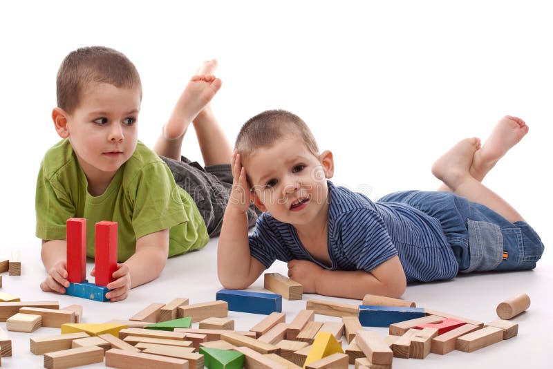 Two boys with blocks stock photo. Image of sitting, learning - 34853026