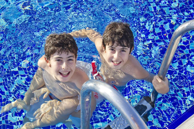 Two Boys in Pool stock image. Image of freedom, pool, active - 471361