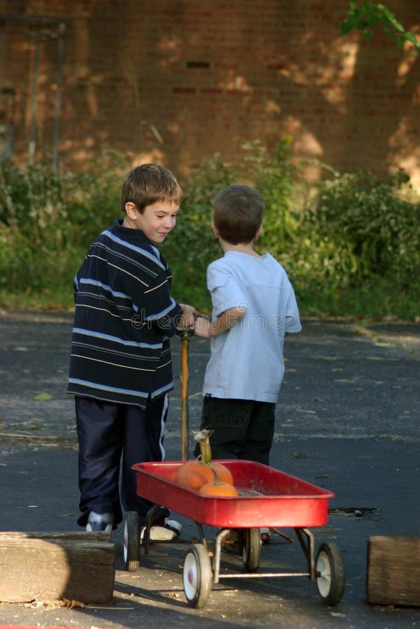 Boys Pulling Wagon stock photo. Image of sibling, caucasian - 1333156