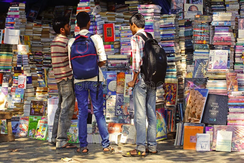 Boys Reading the Titles of Books in the Street. Editorial Stock Photo ...