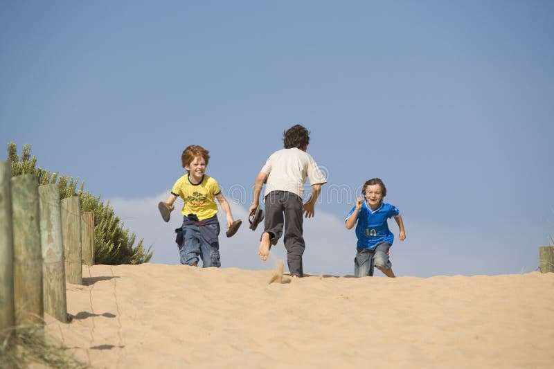 Boys Running on Sand stock photo. Image of male, caucasian - 29656396