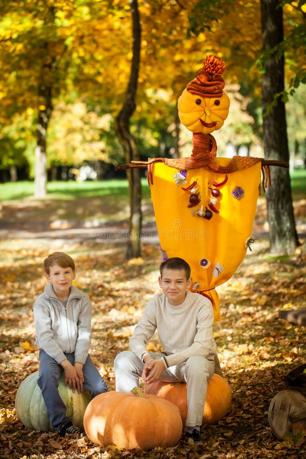 Boys with a scarecrow stock photo. Image of child, foliage - 99346578