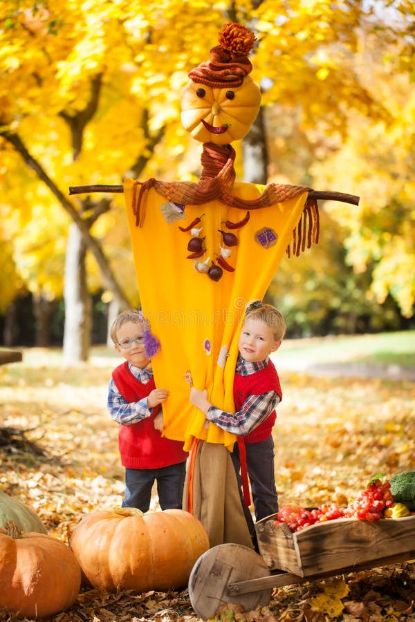 Boys with a scarecrow stock image. Image of pretty, childhood - 99346739