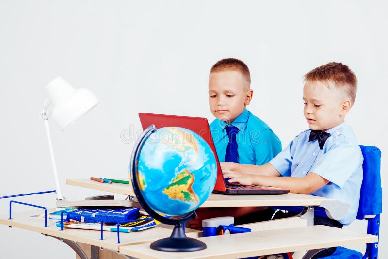 Boys Schoolchildren in Class at a Desk in the Classroom at School Stock ...