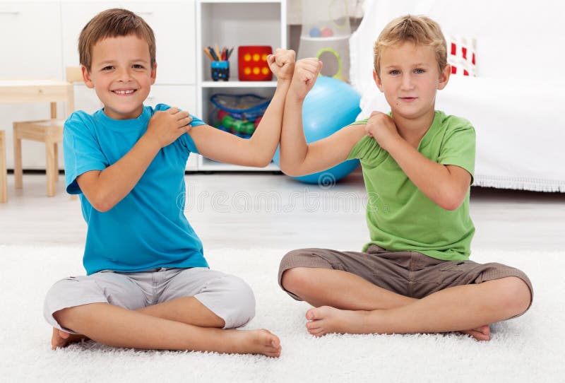 Boys showing their biceps stock image. Image of friends - 21922233