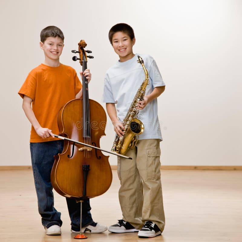 Boys Standing with Cello and Saxophone Stock Image - Image of friend ...
