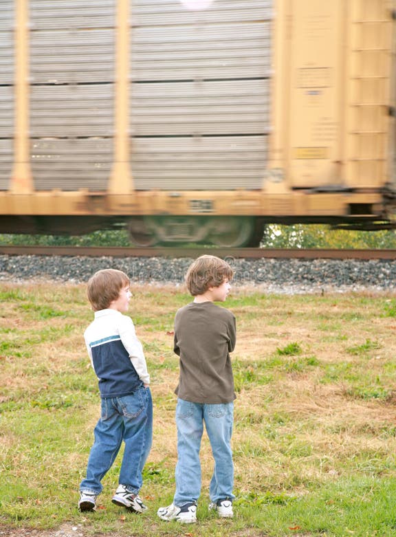 Boys Watching a Train Go by Stock Image - Image of child, love: 4464271