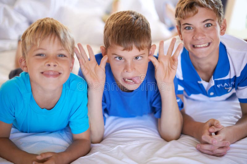Boys Will Be Boys. Three Brothers Pulling Funny Faces at the Camera ...