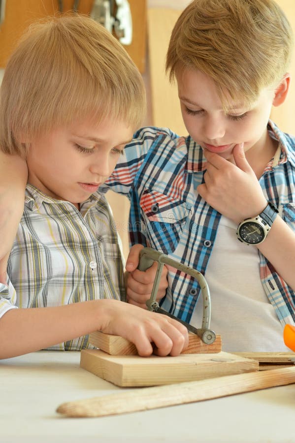 Boys Working with Wood in Workshop Stock Photo - Image of boyhood ...