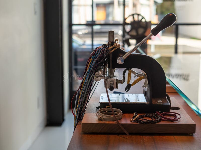 Bracelet Making Machine with Braids and Materials Hanging Off Stock ...