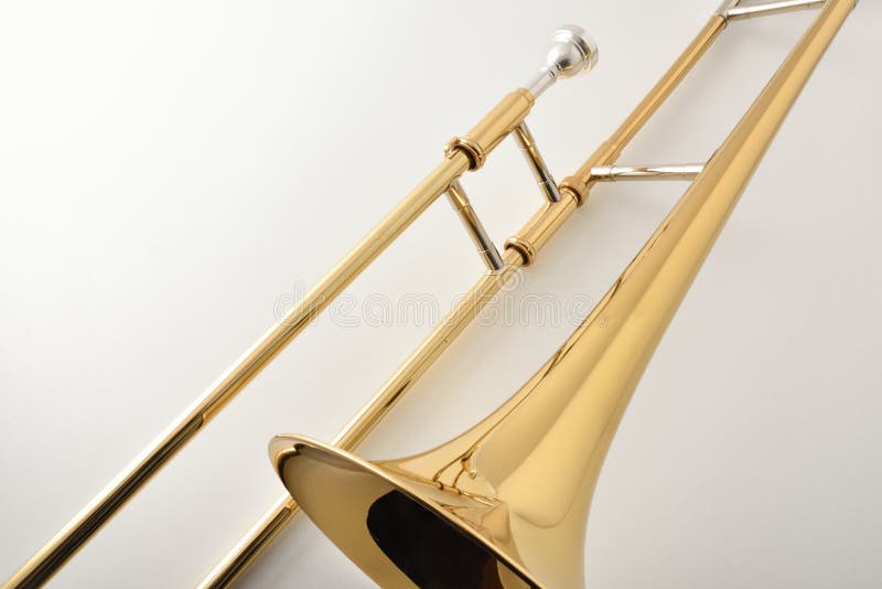 Braces and Mouthpiece of a Trombone on White Table Stock Image - Image ...