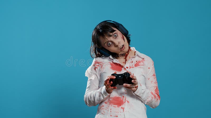 Brain Dead Spooky Looking Zombie with Modern Controller Playing on Blue ...