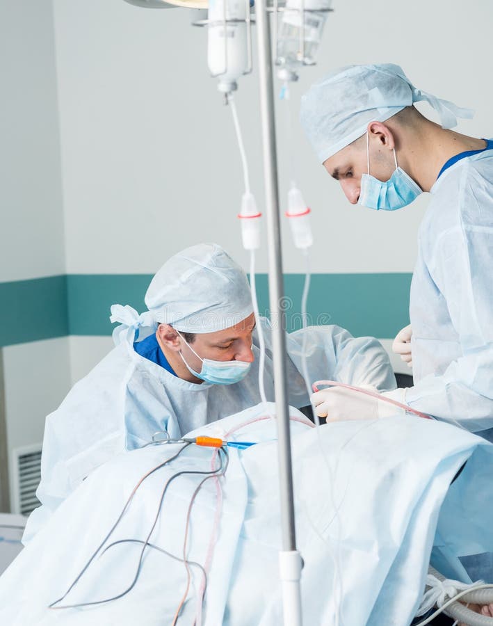 Brain Surgery. Group Of Surgeons In Operating Room With Surgery ...