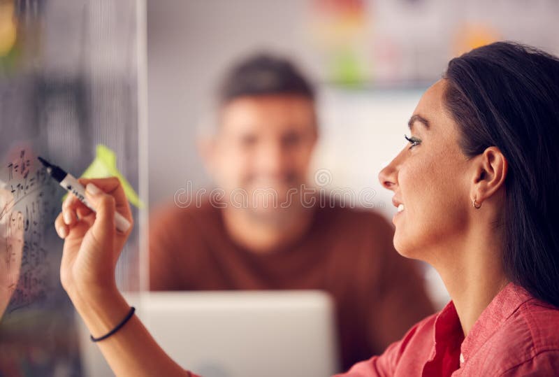 Brainstorming Creative Business Team Putting Ideas Onto Glass Screen in ...