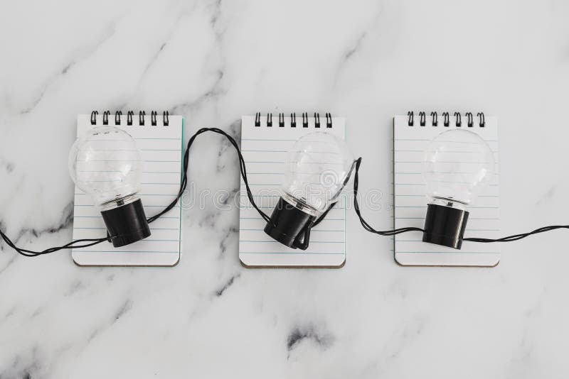 Brainstorming and Finding Innovative Ideas, Group of Notepads with ...