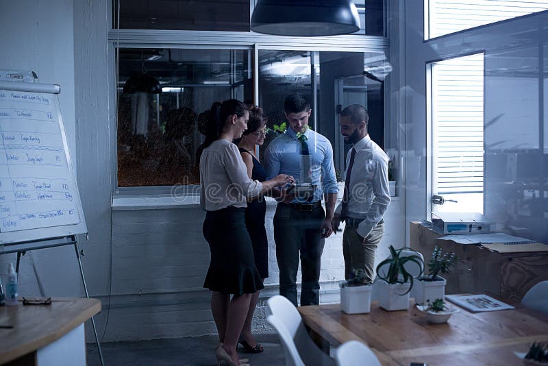 Brainstorming Late into the Work Day Stock Photo - Image of person ...