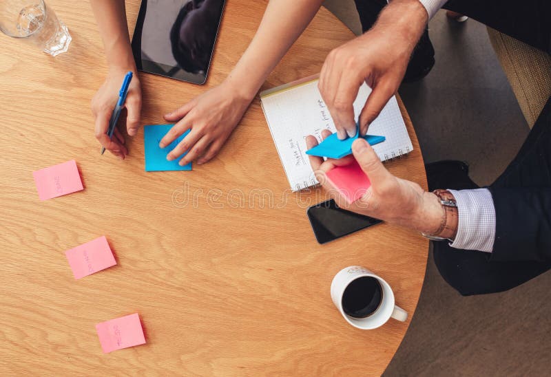 Brainstorming Session with Post it Notes on Table Stock Photo - Image ...