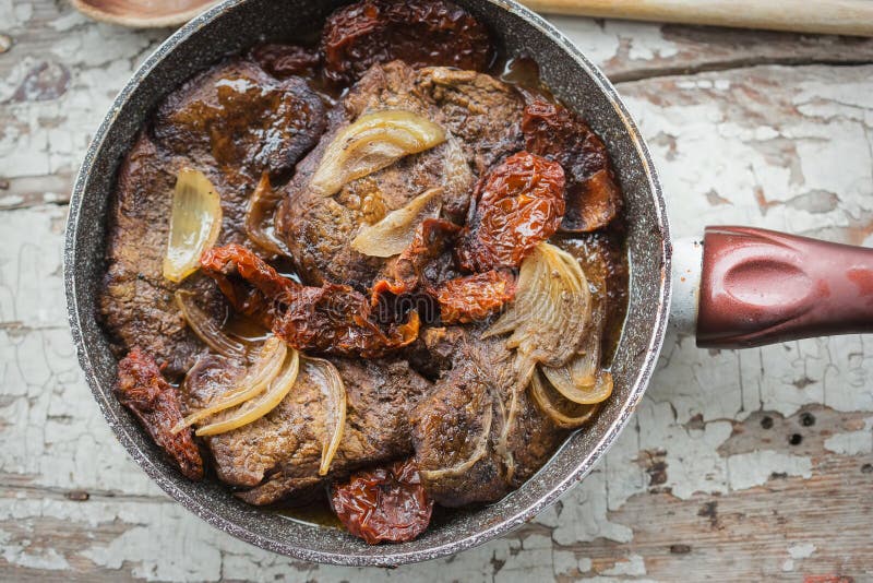 Braised Beef Steak in Red Wine with Sun Dried Tomatoes Stock Photo ...