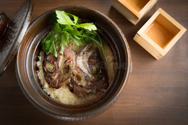 Braised Fish Head with Rice in Pot on the Table Stock Image - Image of ...