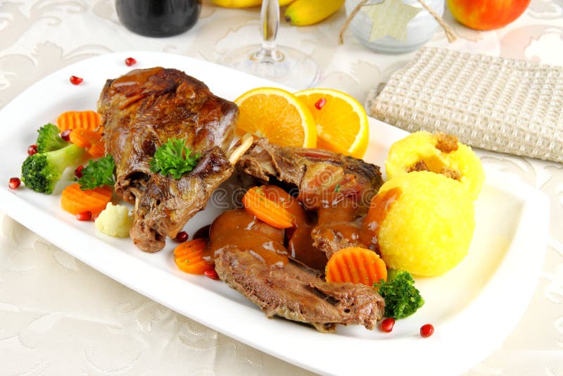 Braised Rabbit Meat with Potato Dumplings and Vegetables Stock Photo ...