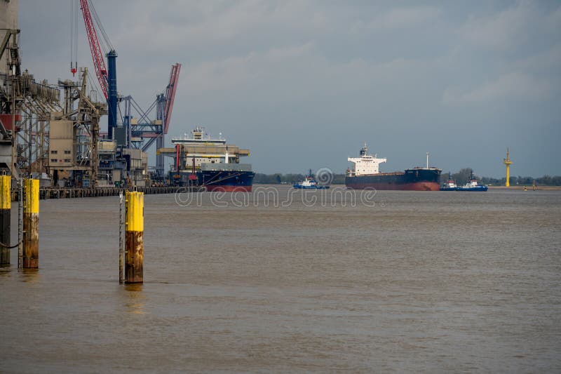 Cargo Ship Named Express Pulled Harbor Tugboats Stock Photos - Free ...