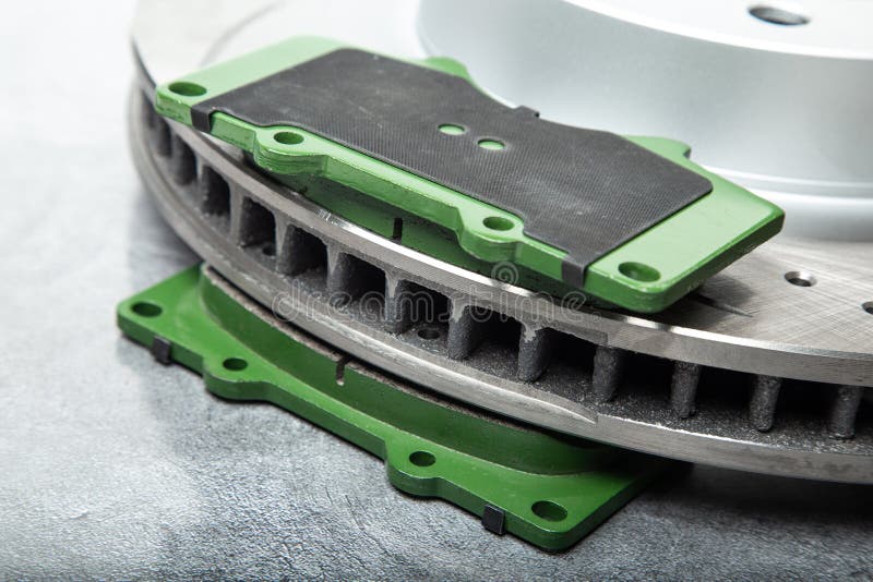 Brake Pads and Perforated Brake Discs on a Stone Gray Table Stock Image ...