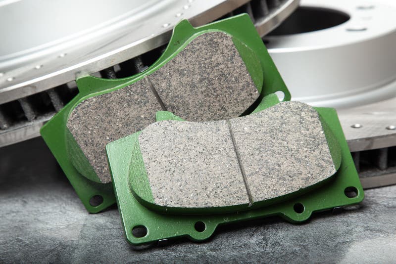 Brake Pads and Perforated Brake Discs on a Stone Gray Table Stock Photo ...