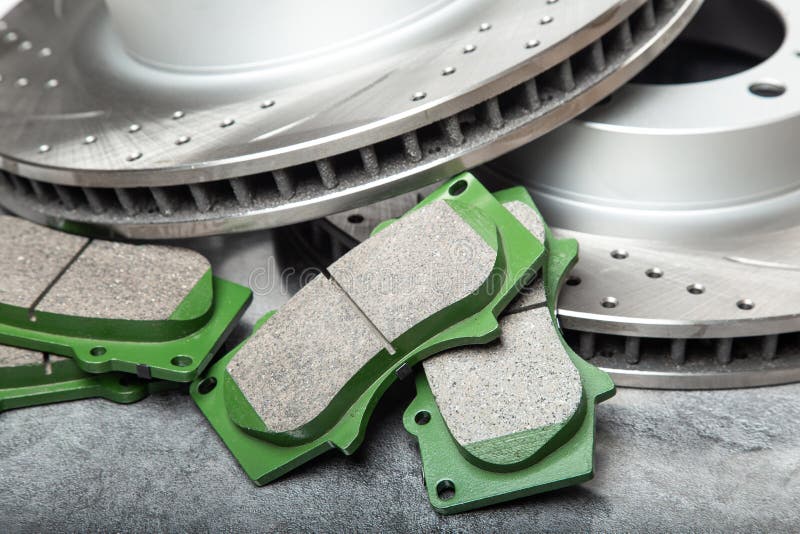 Brake Pads and Perforated Brake Discs on a Stone Gray Table Stock Photo ...