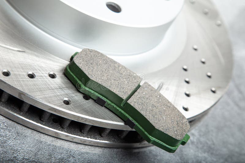 Brake Pads and Perforated Brake Discs on a Stone Gray Table Stock Photo ...