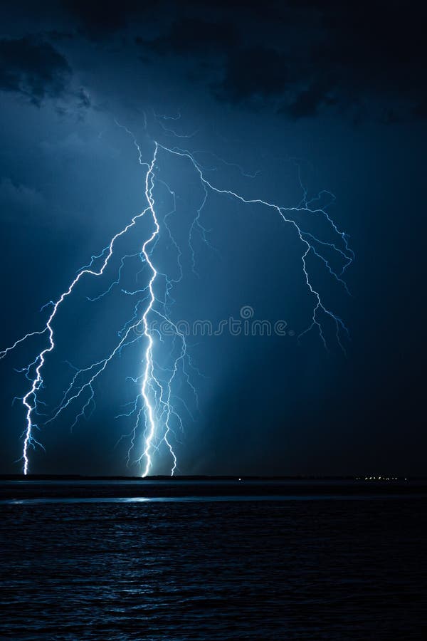 Branched Lightning Bolts Strike Down in the Water Stock Photo - Image ...