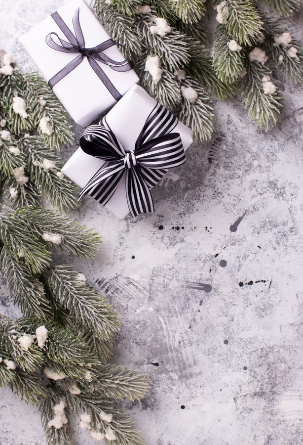 Branches of Fir Tree and Wrapped Boxes with Presents on Grey Textured ...