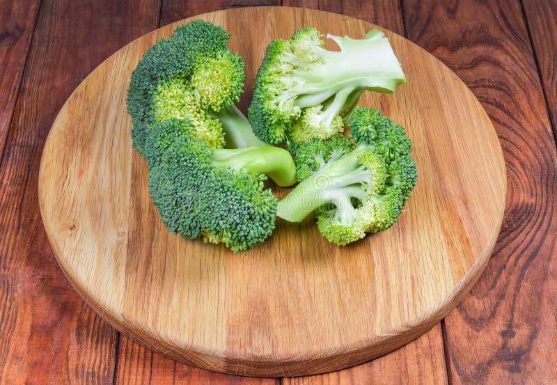 Branches of Fresh Raw Broccoli on the Wooden Serving Board Stock Image ...