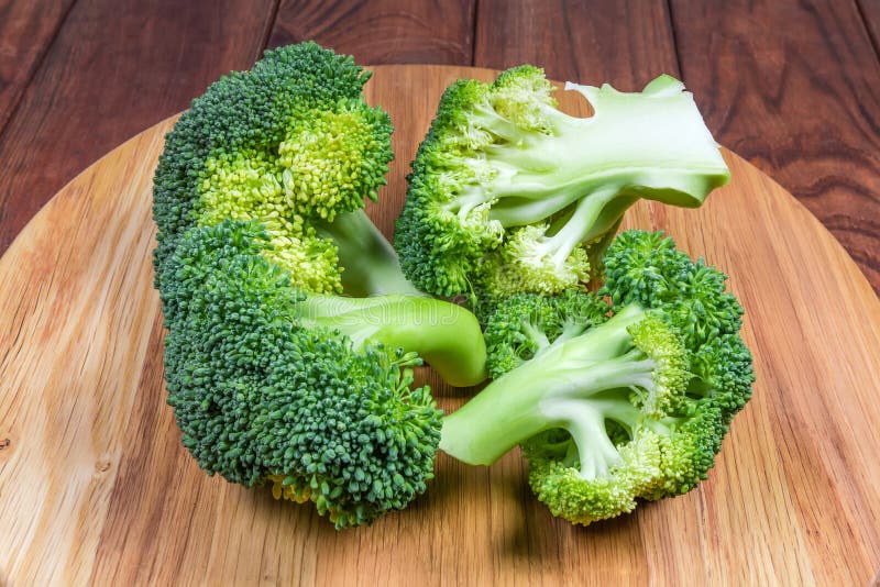 Branches of Fresh Raw Broccoli on the Wooden Surface Stock Image ...