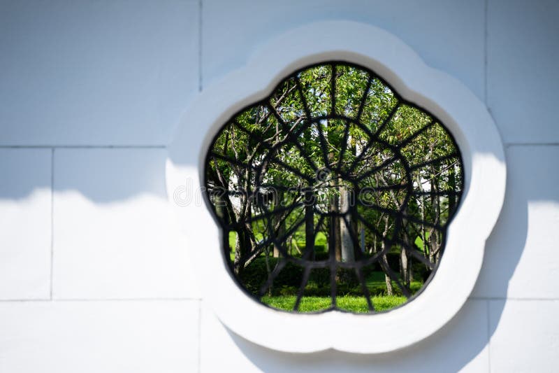 Branches and Leaves Seen through Flower-shaped Windows Stock Image ...