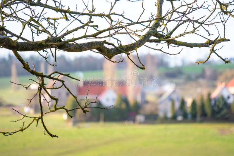 The Branches of a Spring Tree and the Village on the Horizon Stock ...